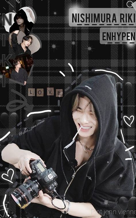 A Woman Holding A Camera In Her Right Hand And Wearing A Hoodie On Top