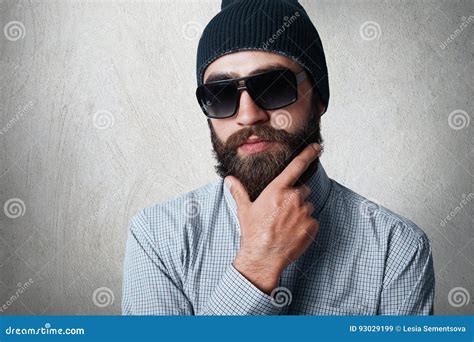 Close Up Portrait Of Handsome Bearded Man Wearing Stylish Black Cap