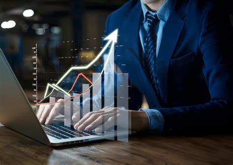 Premium Photo A Man Is Working On A Laptop With A Graph That Says Quot Graph Quot