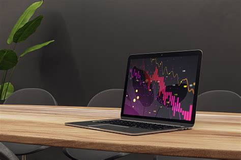 흐릿한 배경에 장식 식물 의자 및 떨어지는 외환 차트 화살표가 있는 나무 사무실 책상에 노트북을 닫습니다 금융 위기 무역 및 경기 침체 개념 3d 렌더링 0명에 대한 스톡