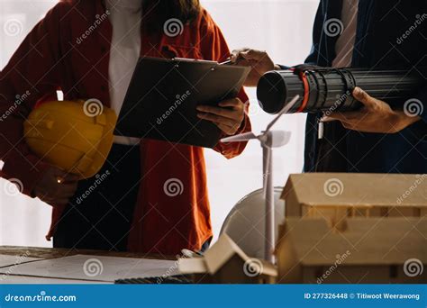 Professional Mechanical Engineer Team Working On Personal Computer At