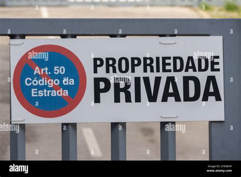Private Property Sign In Portuguese Hanging On A Metal Gate Indicating Restricted Access And No