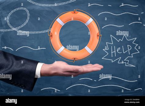Hand Holding Lifesaver Life Preserver Hi Res Stock Photography And