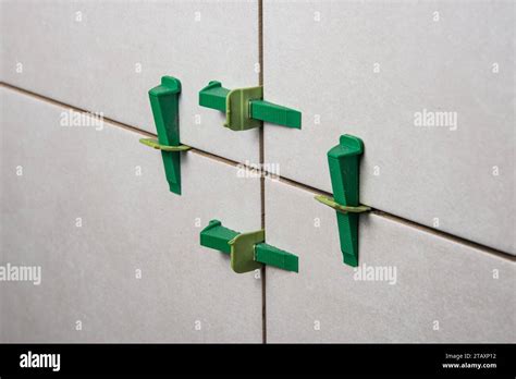 Tile Leveling System With Plastic Clips And Wedges Shot While The Tile