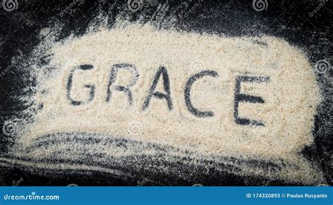 Closeup Of Grace Word Written On White Sand Stock Image Image Of