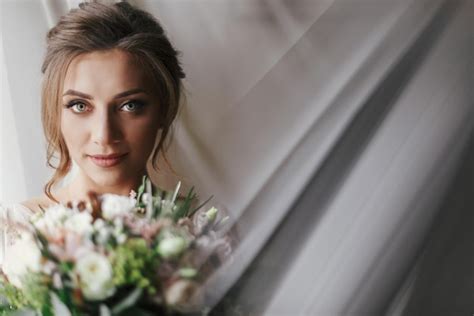 Premium Photo Gorgeous Beautiful Bride With Bouquet Posing At Window