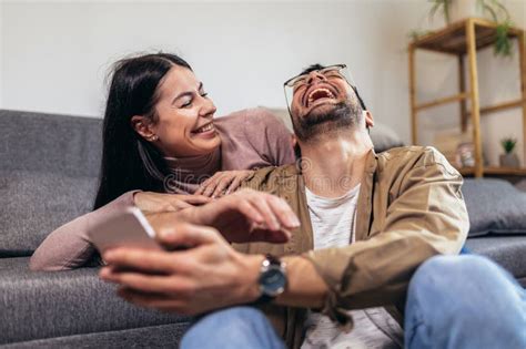 Young Loving Couple Bonding To Each Other And Making Selfie While