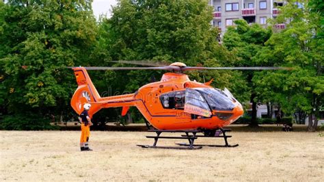 Modern Orange Paramedic Ambulance Emergency Aircraft Germany On Helipad