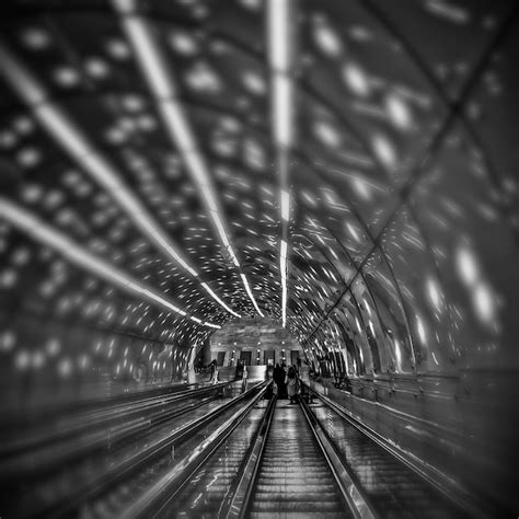 Premium Photo People Walking On Illuminated Tunnel