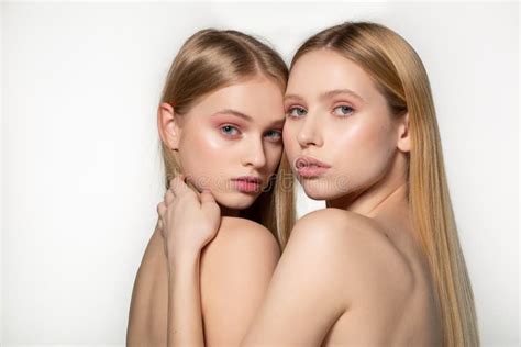Two Attractive Twins Woman With Blonde Long Hair Posing In Glamour