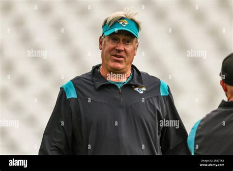 Jacksonville Jaguars Head Coach Doug Pederson Talks With A Staff Member