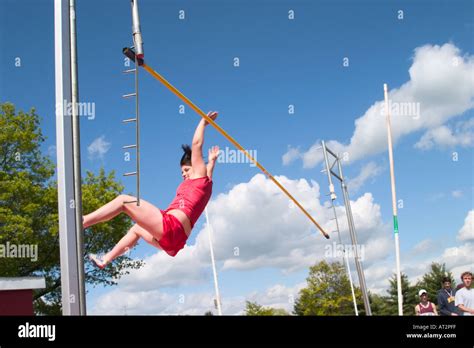 High School Girl Attempting A Pole Vault In A Track And Field Meet