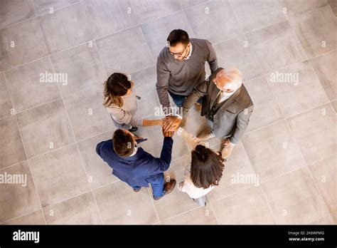 Aerial View At Business People Team Stack Hands As Unity Gesture In The