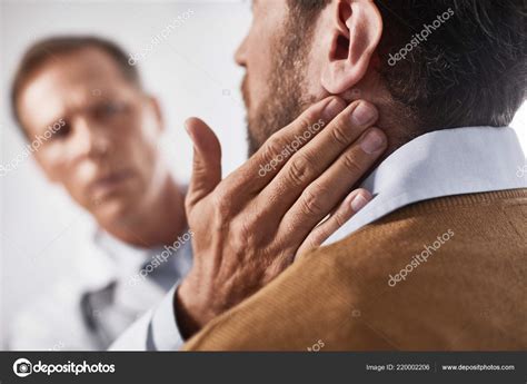 Palpation Of Occipital Lymph Nodes During Routine Inspection Stock