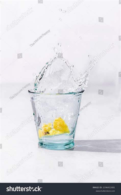 Lemon Creating Splash Small Glass Water Stock Photo 2196412081