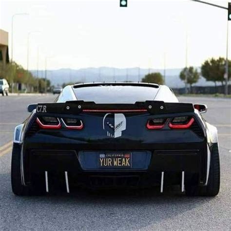 The Rear End Of A Black Sports Car