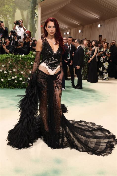 Dua Lipa Wears Lace And Feathers Naked Dress At 2024 Met Gala