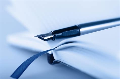 Premium Photo Pen On The Notebook