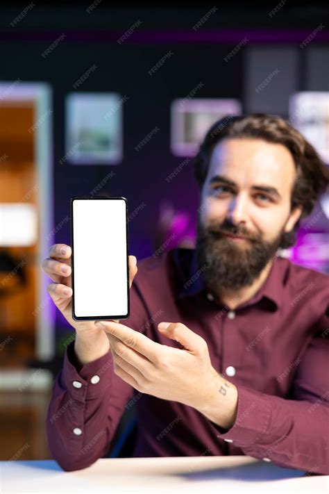 Premium Photo Portrait Of Smiling Tech Guru Assessing Isolated Screen