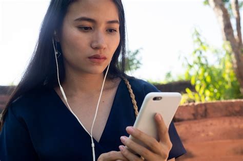 Premium Photo Low Angle View Of Man Using Mobile Phone