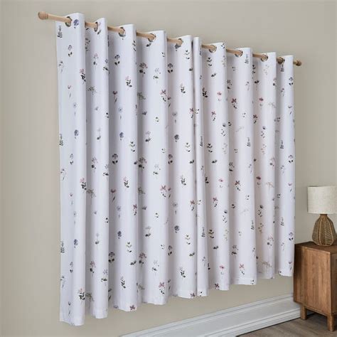 Pressed Floral Blackout Eyelet Curtains Dunelm