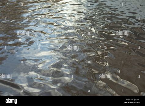 Texture Of Water Surface Of Puddle Small Waves Reflection In Water Stock Photo Alamy