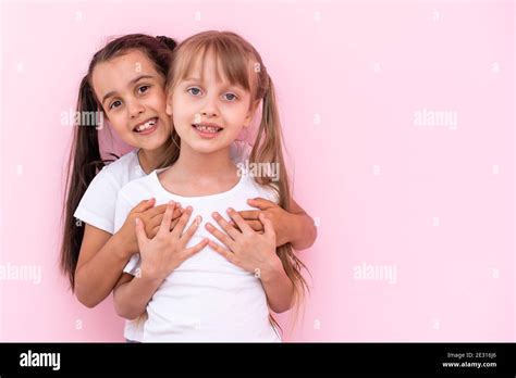 Free Vector Two Cute Girls Hugging Each Other