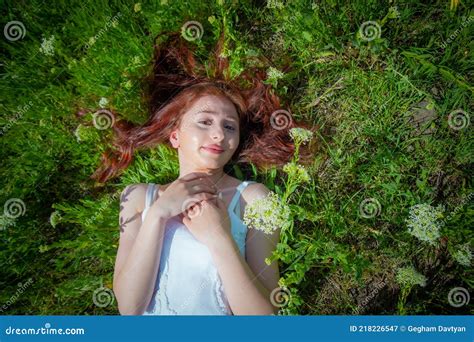 Red Haired Woman In The Park Pretty Woman In The Grass Pretty Woman