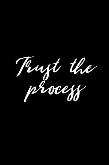The Words Trust The Process Are Written In White Ink On A Black