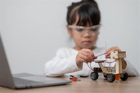 Premium Photo Asia Students Learn At Home In Coding Robot Cars And