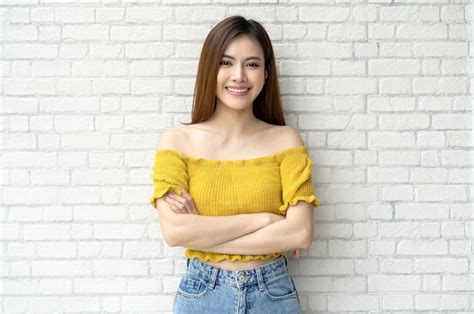 Premium Photo Smiling Asian Woman Wearing Off Shoulder Yellow Knitted