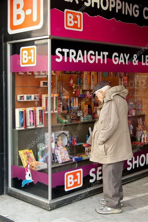 Man Looks At Sexshop Showcase In Amsterdam Stock Editorial Photo
