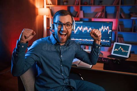 Happy Stock Trader Is Working By Pc Indoors And Celebrating Success