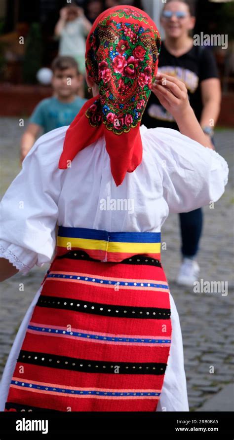A Girl In Traditional Dress At A Cultural Festival In Transylvania
