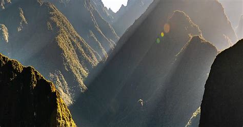 Beams Of Light And Jagged Peaks In The Andes Mountains Machu Picchu
