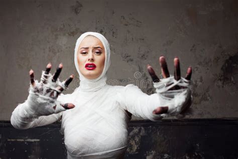 Beautiful Young Woman In Bandages Girl In A Mummy Costume Pulling