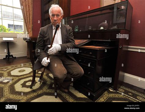 Simon Callow Holds Charles Dickenss Walking Stick For A New Exhibition