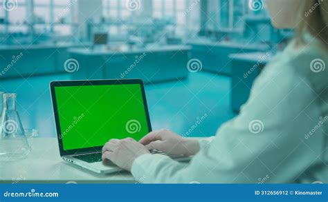 Laptop With Green Screen On Research Biochemistry Lab Desk Advertising Area Workspace Mock Up