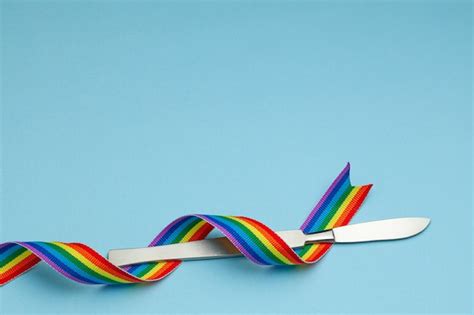 Premium Photo Scalpel And Rainbow LGBT Ribbon Pride Symbol Sex Change Operation Blue