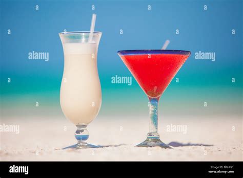 Two Cocktails Pina Colada And Margarita On White Sand Beach Stock