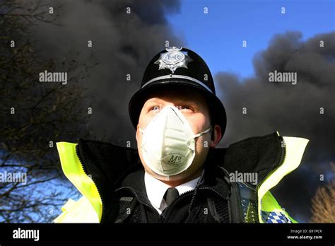 A Police Officer On Patrol In A Residential Area Of Hemel Hempstead On