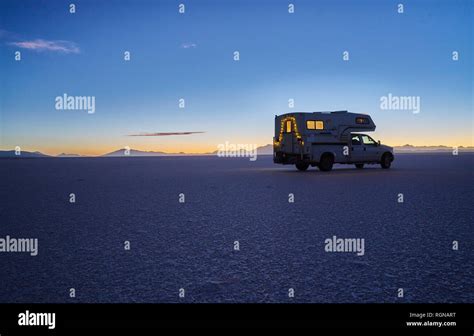 Bolivia Salar De Uyuni Camper On Salt Lake At Sunset Stock Photo Alamy