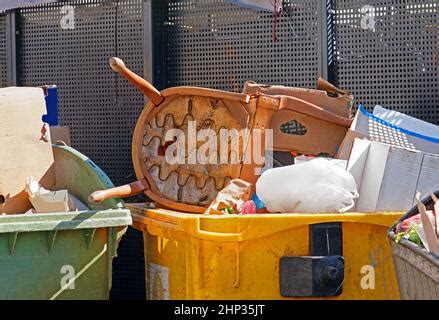 Plastic Containers Overflown With Garbage On Urban City Street Stock