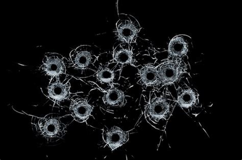 Premium Photo Broken Glass Multiple Bullet Holes In Glass Isolated On