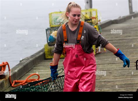 A Lobster Fisherwoman Hauling Traps Stock Photo Alamy