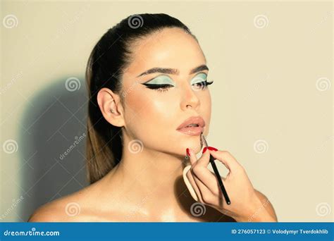 Makeup Artist Applies Red Lipstick Hand Of Make Up Master Painting