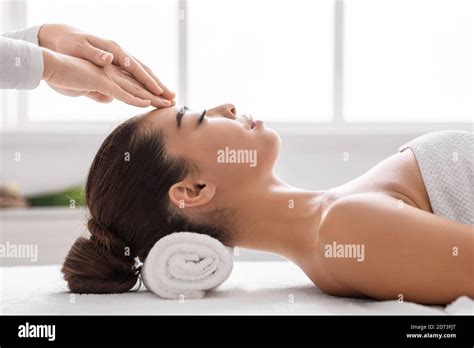 Beautiful Asian Woman In Spa Salon Enjoying Acupressure Head Massage