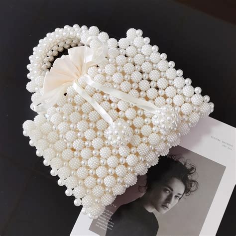 2021 럭셔리 디자이너 핸드백 여성용 탑 핸들 백 프랑스 스타일 베이베리 볼 직조 비즈 진주 파티 Abs 이브닝 백 패션