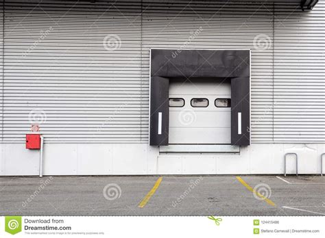Roller Shutter Door And Concrete Floor Inside Factory Building For