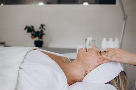 Premium Photo Young Woman Enjoying Massage In Spa Salon